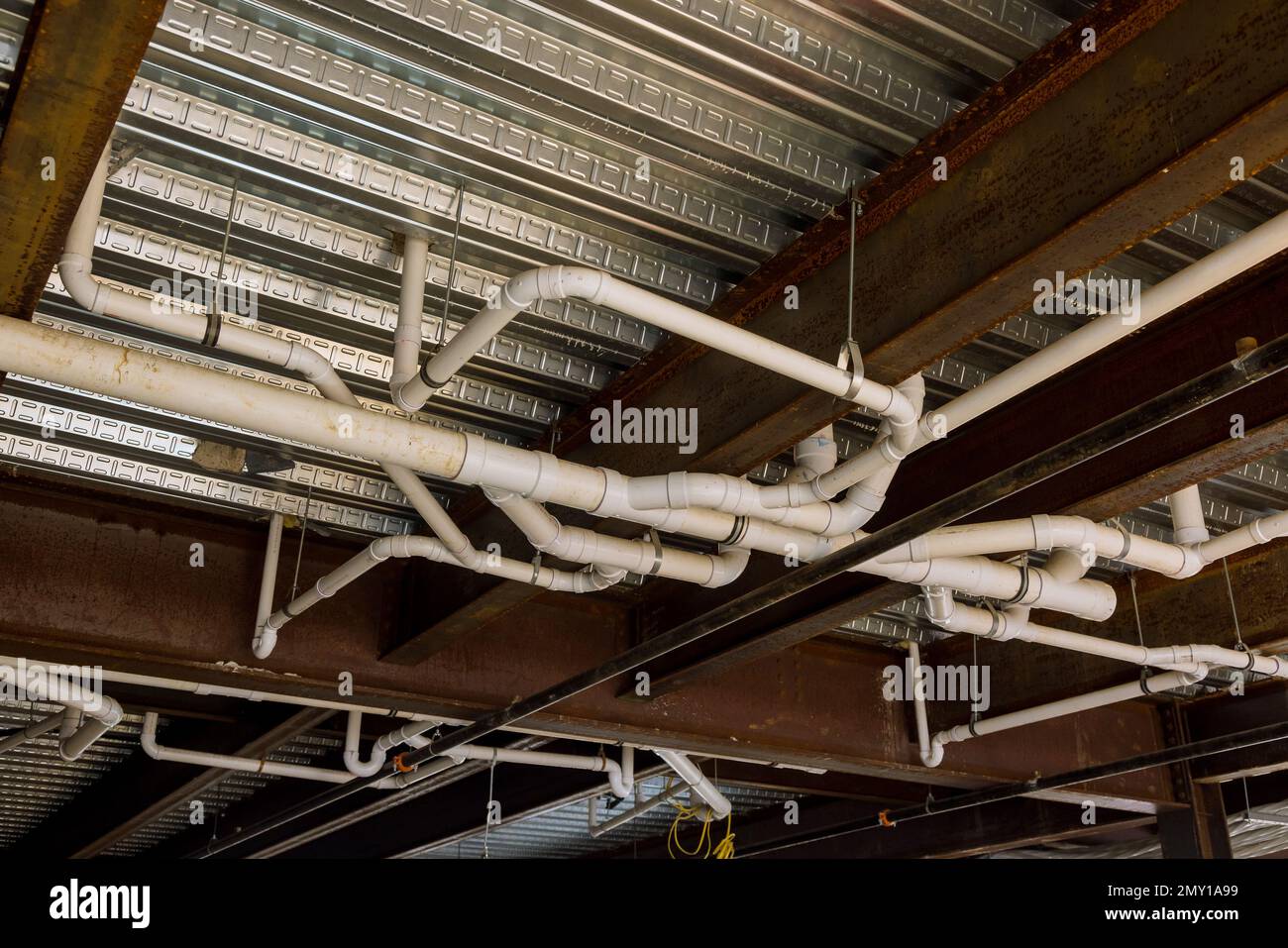 Installation an assembled in waste pipe lines system under ceiling of ...