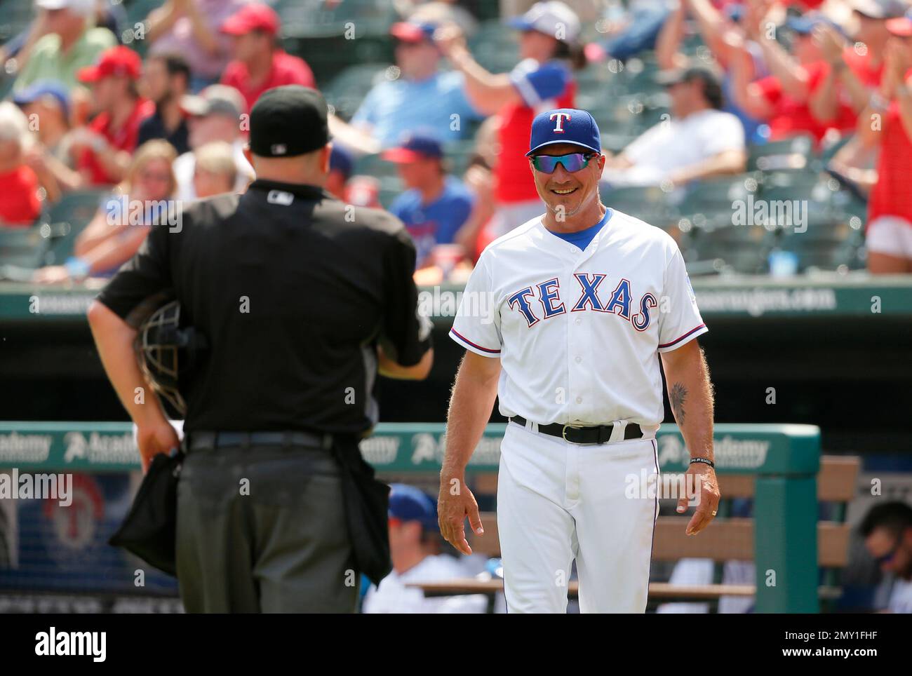Home plate umpire Todd Tichenor talks to Texas Rangers manager Jeff ...