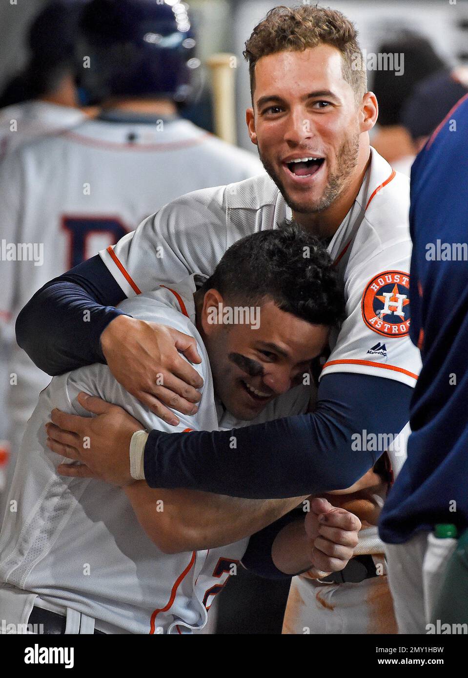 Houston Astros' George Springer, right, hugs Jose Altuve after Altuve ...