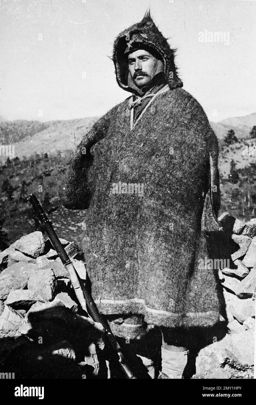 A mustached Greek Soldier soldier wears a woolen "poncho" for ...