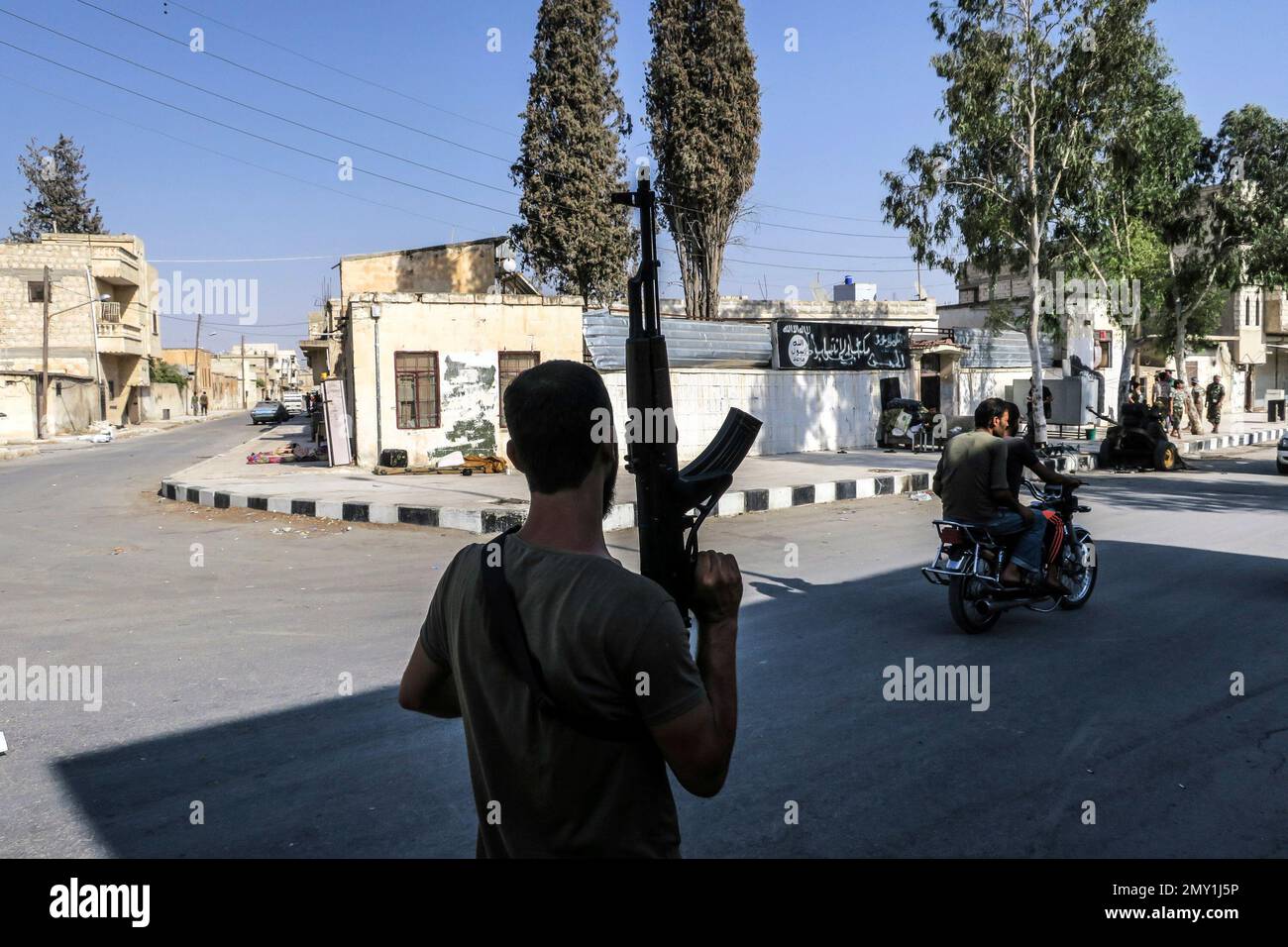 Free Syrian Army fighters patrol in Jarablus, Syria, Wednesday, Aug. 31 ...