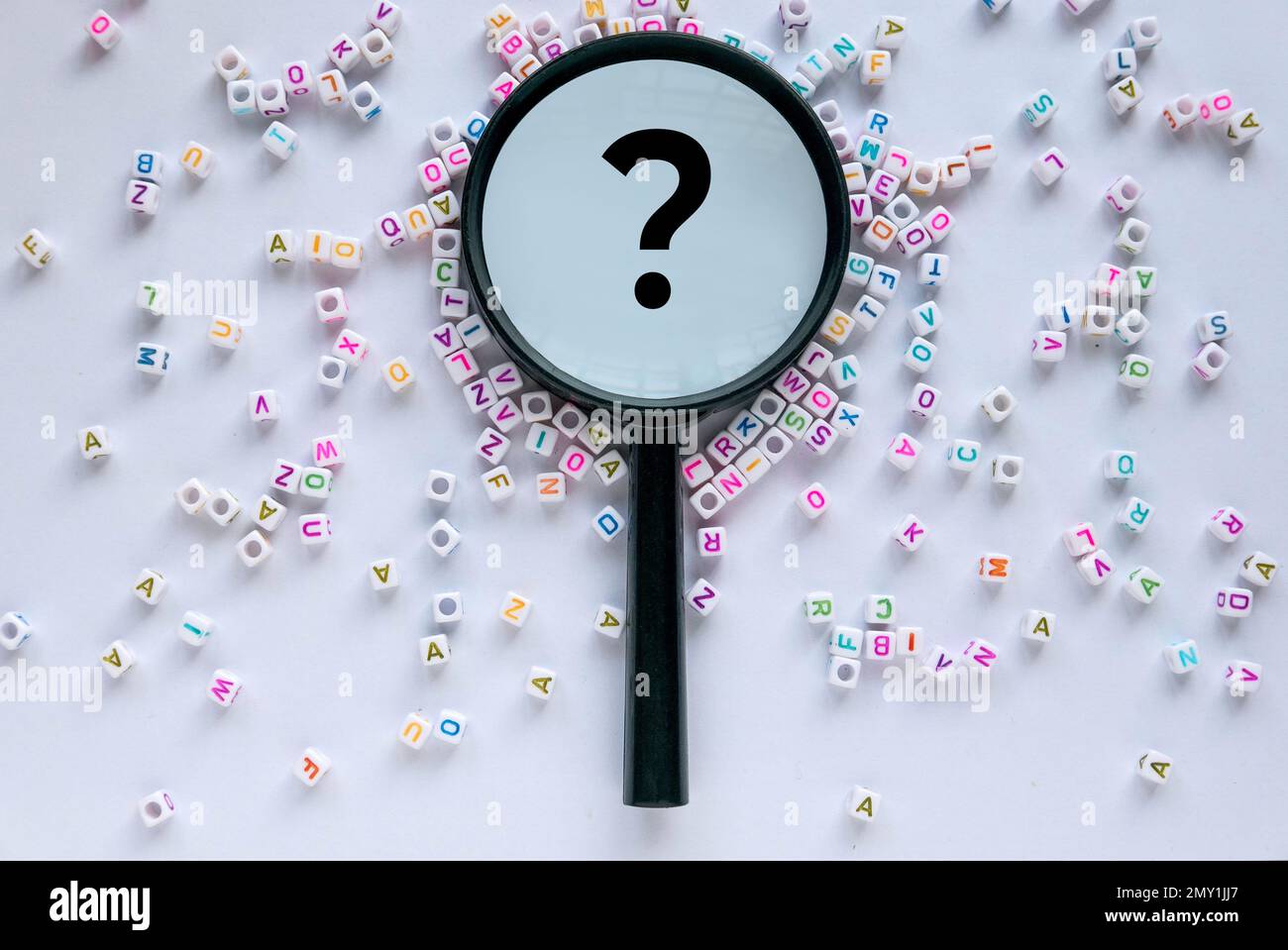 Questions and answers concept. Alphabet beads with magnifying glass ...