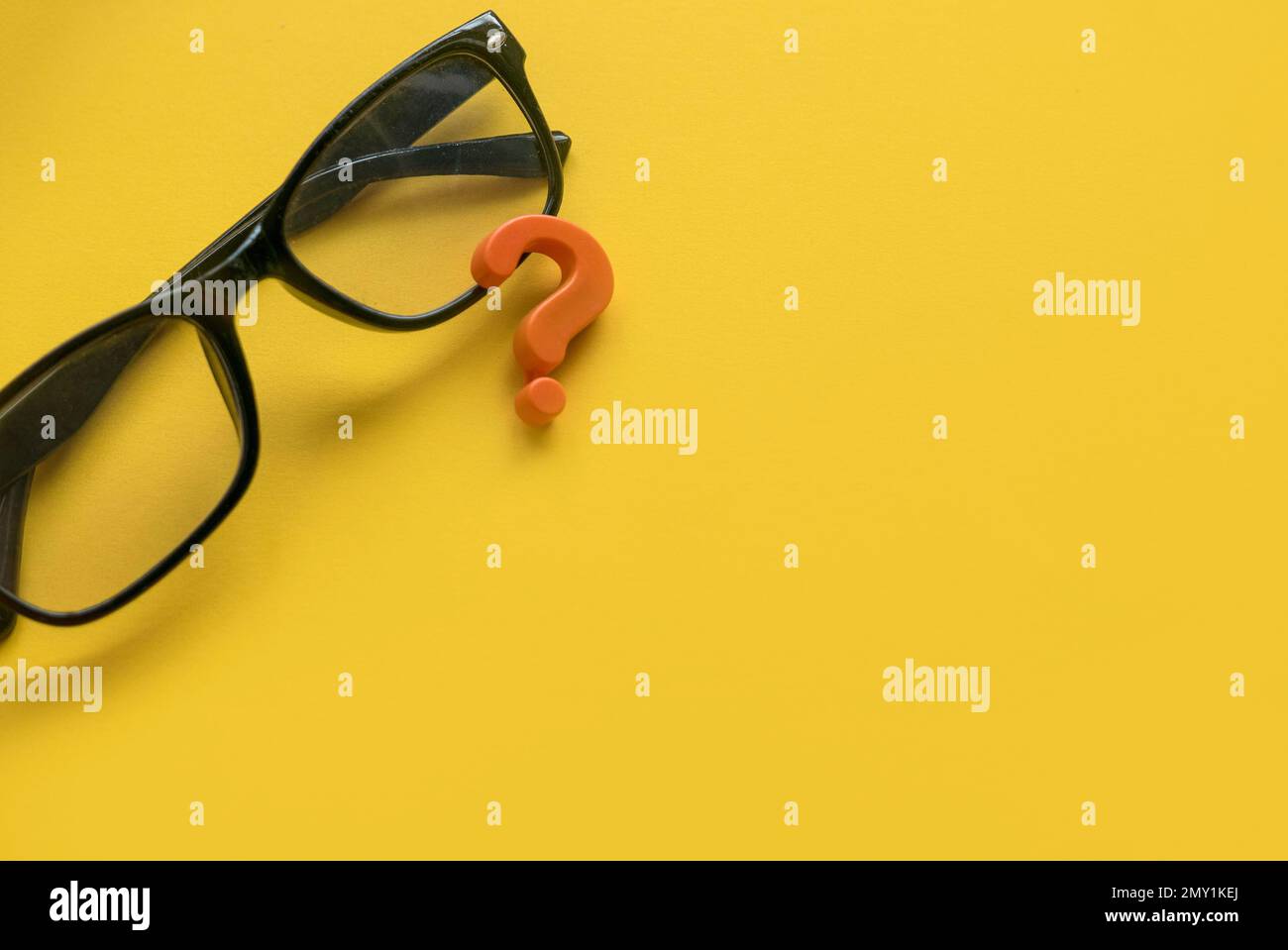 Questions and answers concept. Question symbol and glasses on yellow ...