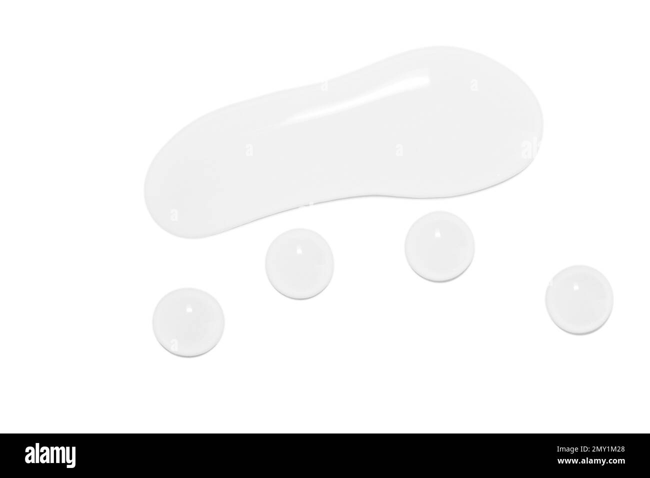 large drops of transparent gel or serum or water, on a white background ...