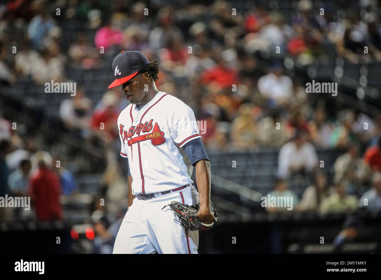 Atlanta Braves pitcher Jose Ramirez walks off the field after striking ...