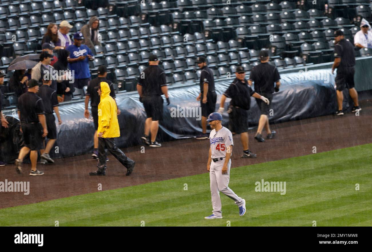Los Angeles Dodgers third base coach Chris Woodward walks to the dugout ...