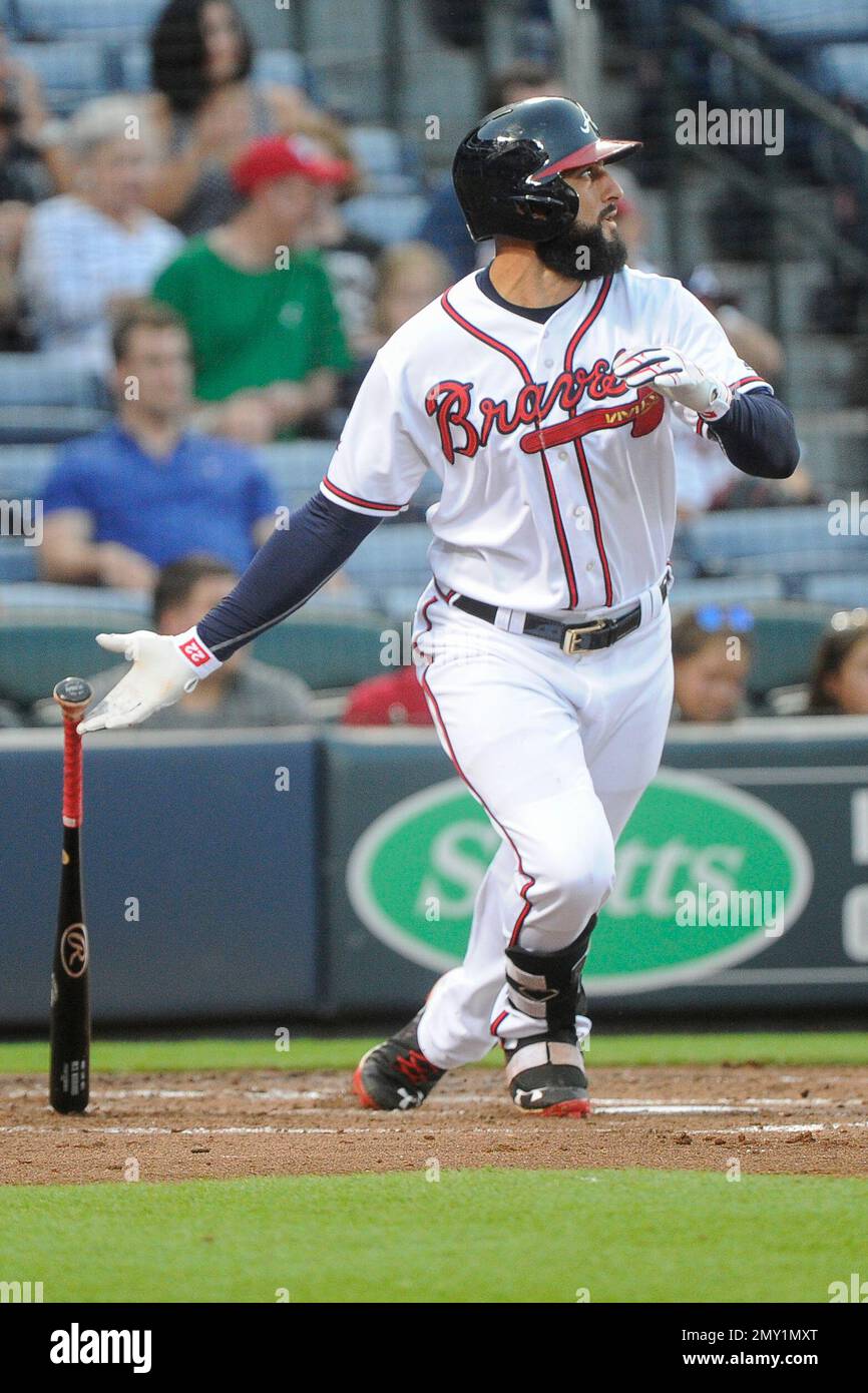 Atlanta Braves' Nick Markakis watches his ball fly to left field as he ...