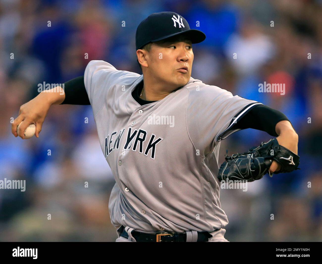 New York Yankees starting pitcher Masahiro Tanaka delivers to a Kansas ...