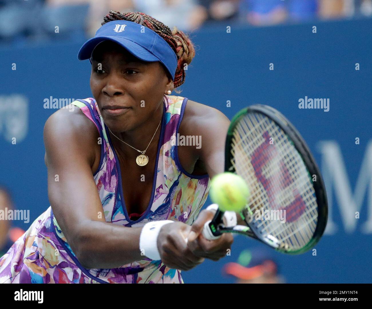 Venus Williams returns a shot to Kateryna Kozlova, of the Ukraine ...