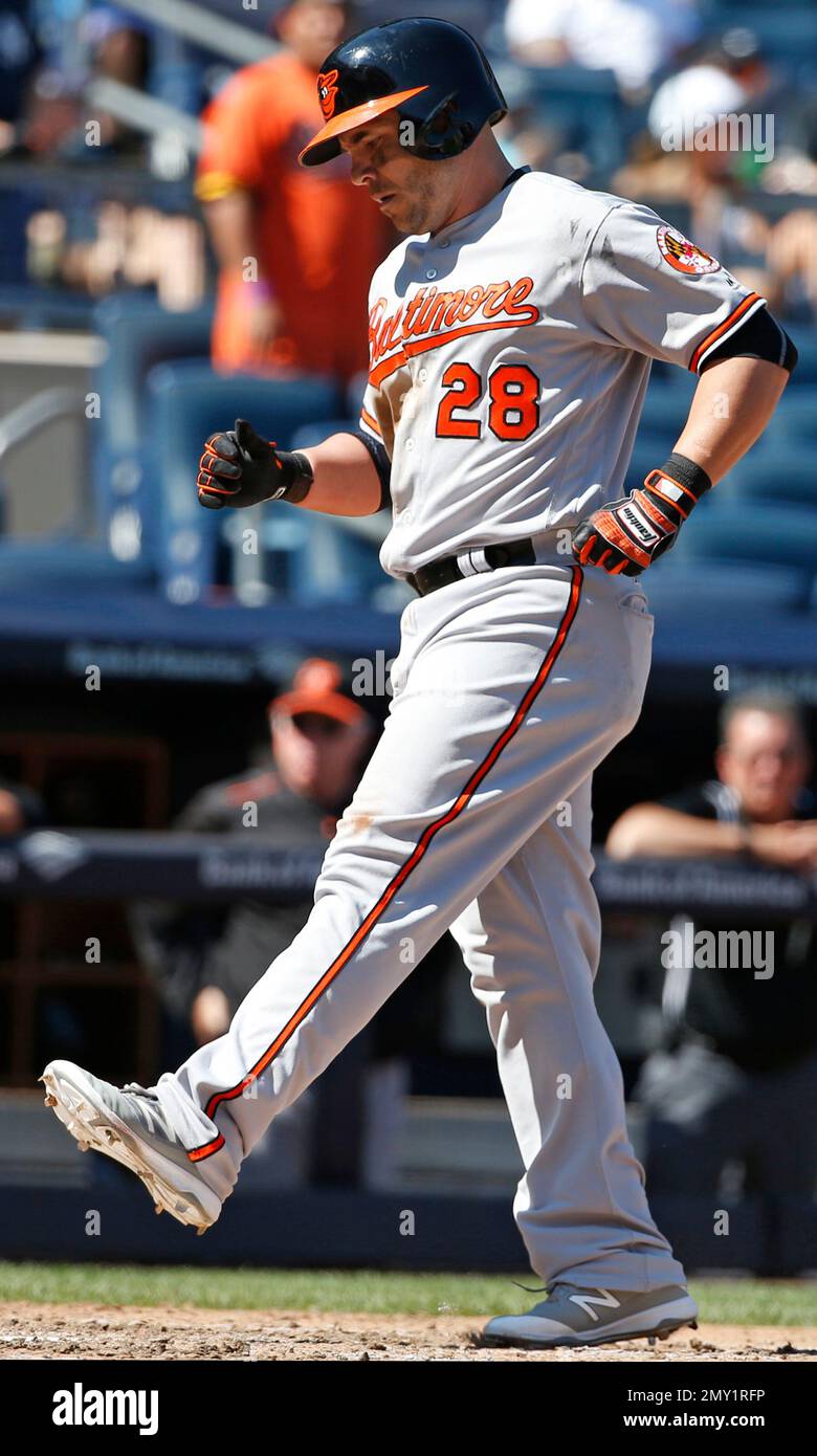 Baltimore Orioles Steve Pearce (28) crosses the plate after hitting a ...