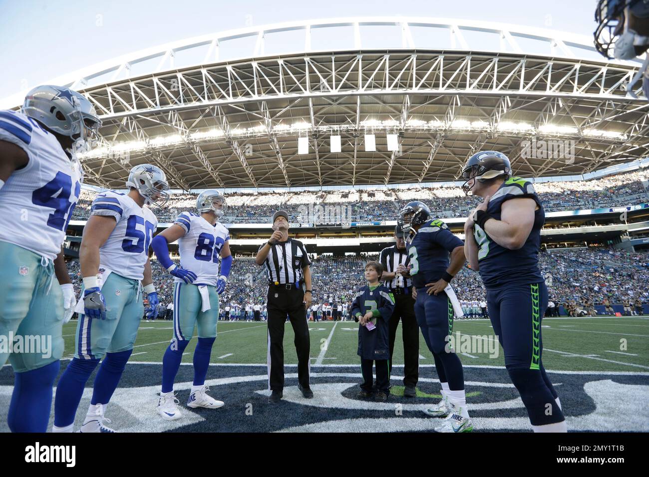 Referee Craig Wrolstad flips the coin before a preseason NFL football ...