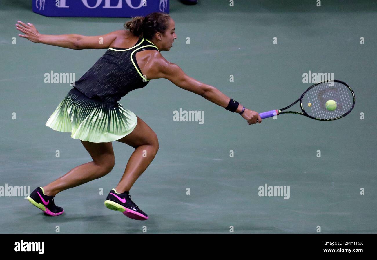Madison Keys, of the United States, returns a shot to Alison Riske, of ...