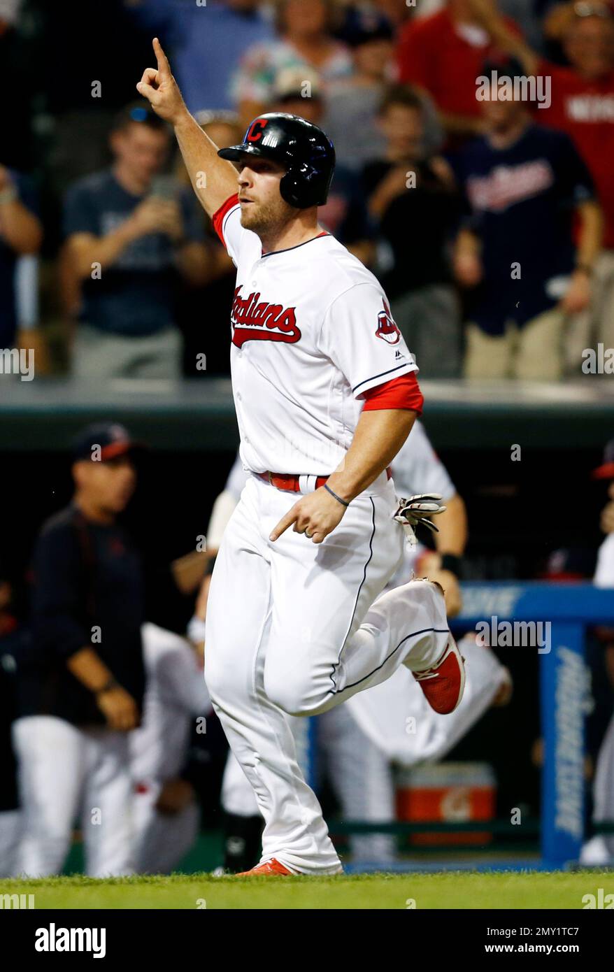 Cleveland Indians catcher Chris Gimenez scores on a single by Jason ...