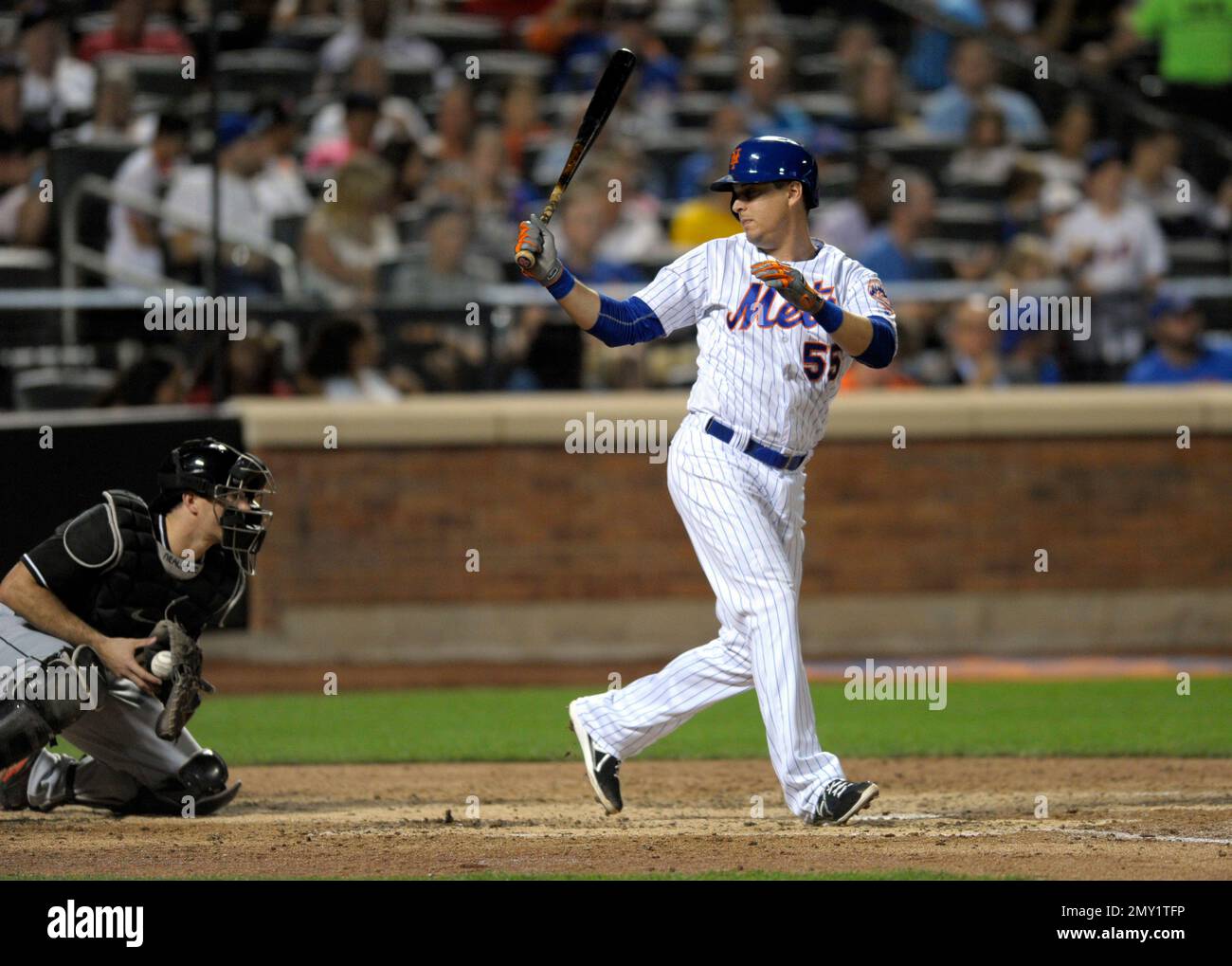 New York Mets' Kelly Johnson looks back at Miami Marlins catcher J.T ...