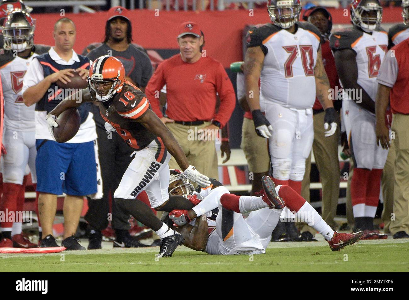 Cleveland Browns wide receiver Taylor Gabriel (18) is brought down by ...