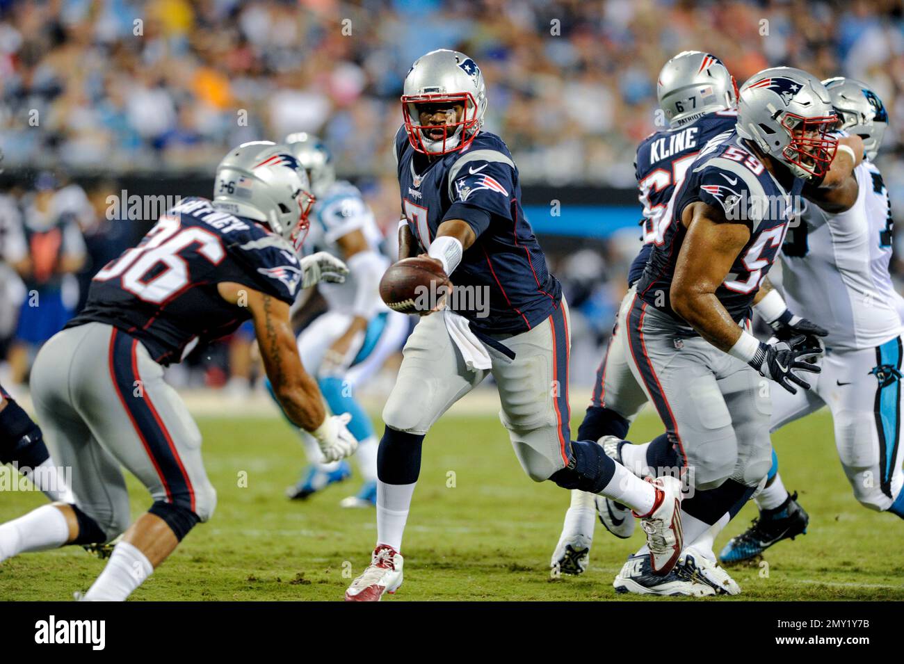New England Patriots quarterback Jacoby Brissett (7) hands the ball off ...