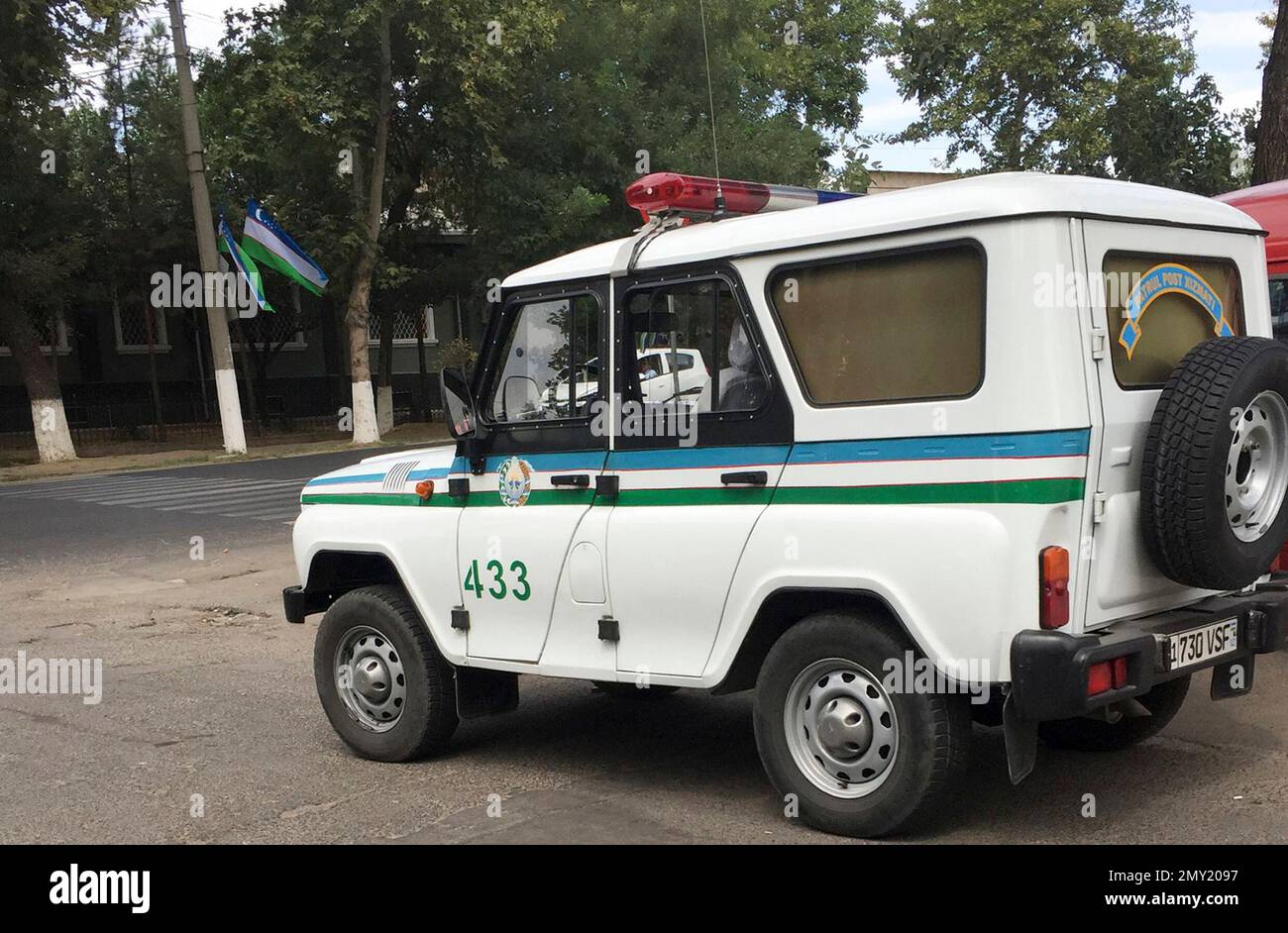 An Uzbek police car parked at an area around the government hospital ...
