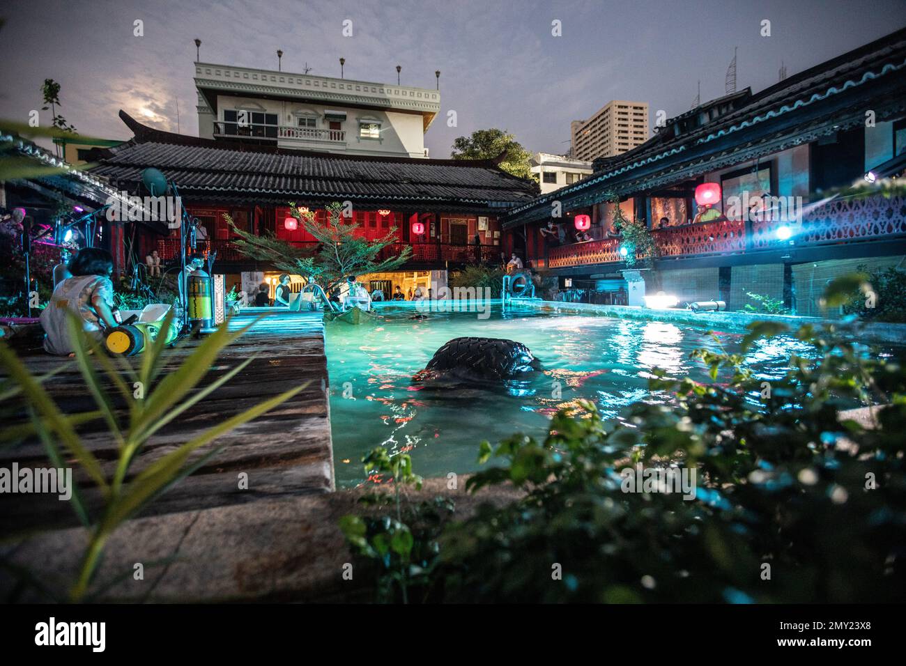 People watch an artistic performance at The So Heng Tai Mansion (100 years old Chinese House ...