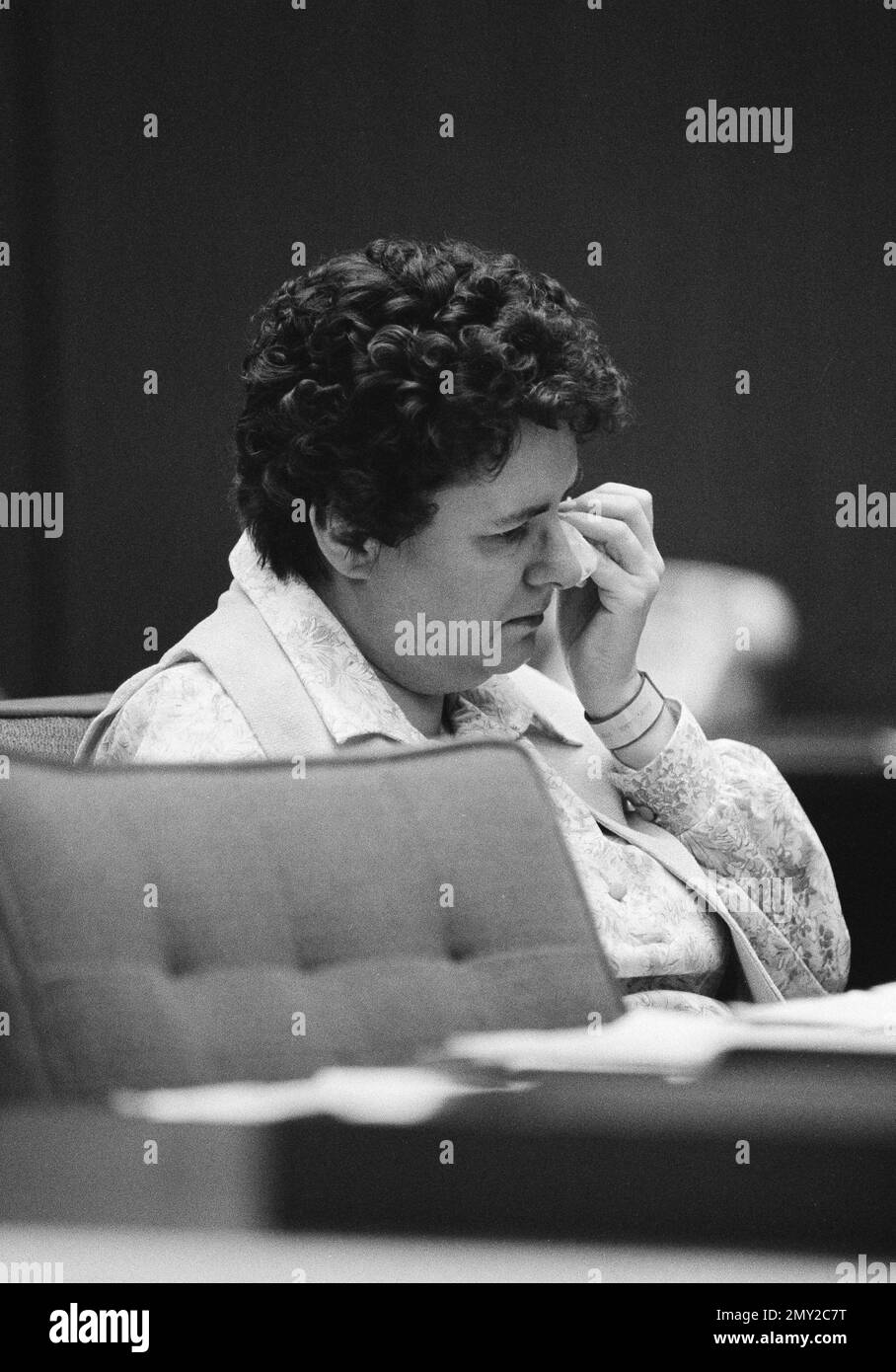 Carol Bundy, a vocational nurse from Burbank, Calif., wipes a tear from ...