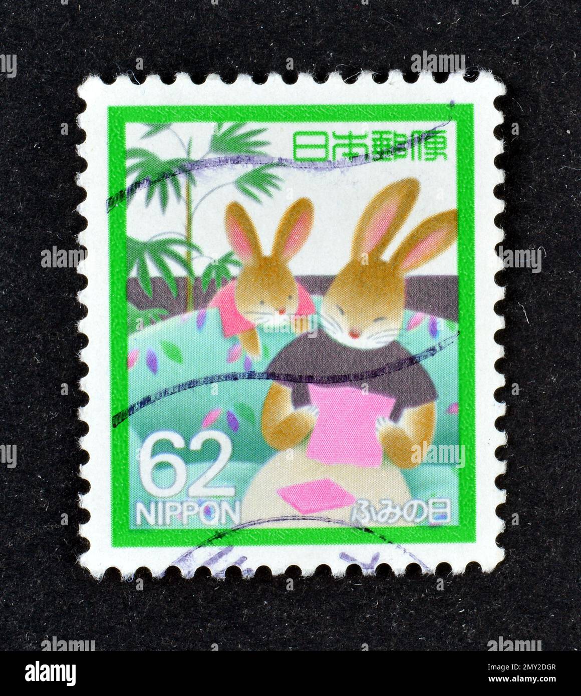 Cancelled postage stamp printed by Japan, that shows Two Rabbits with ...