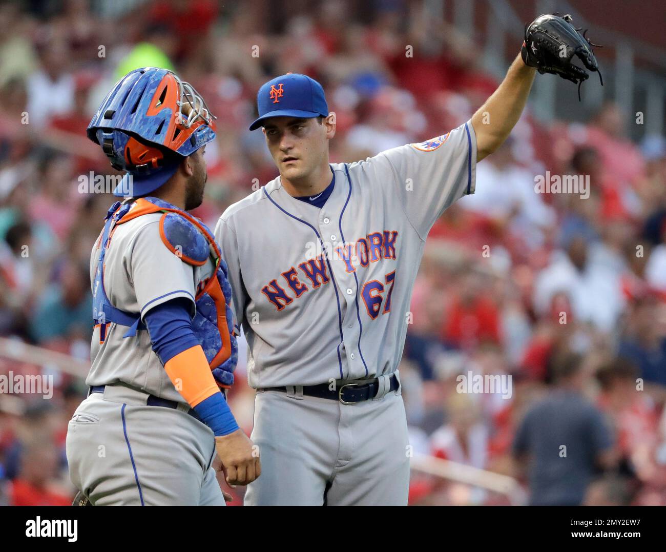 New York Mets starting pitcher Seth Lugo, right, talks with catcher ...