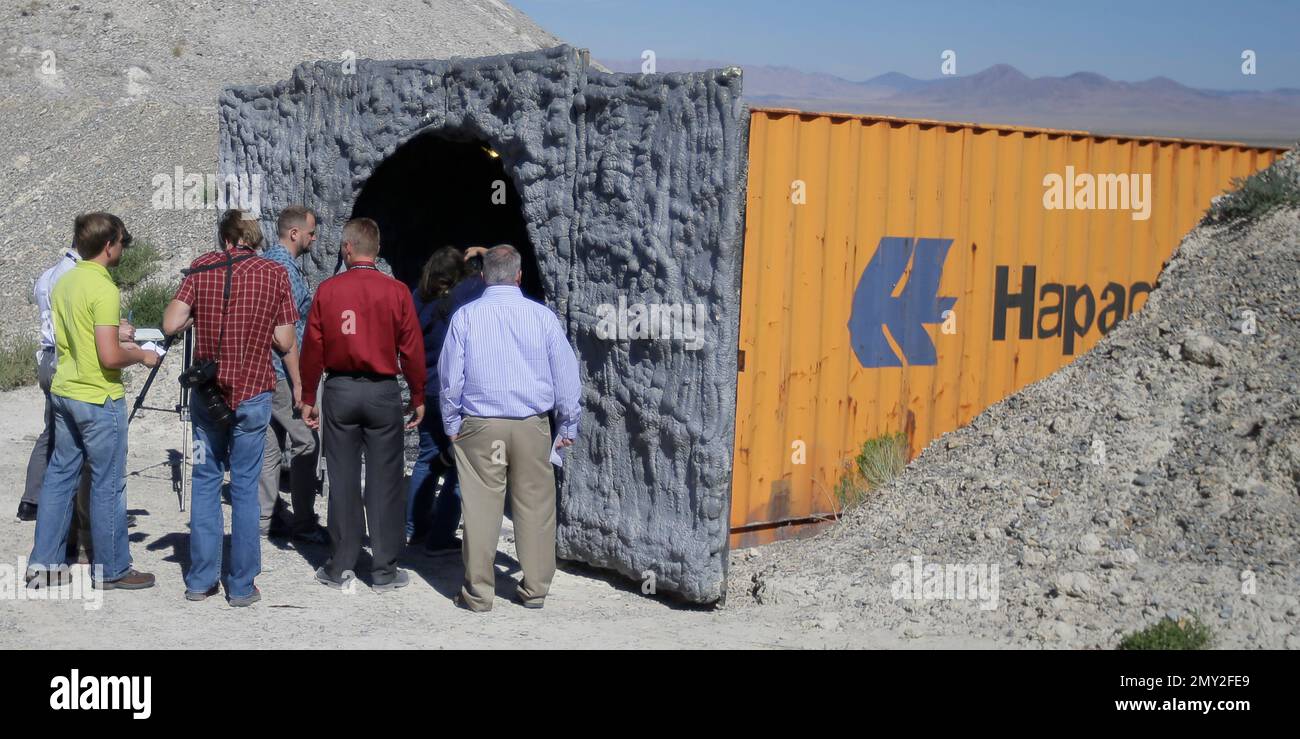 In this Wednesday, Aug. 24, 2016, photo, reporters gather at the ...