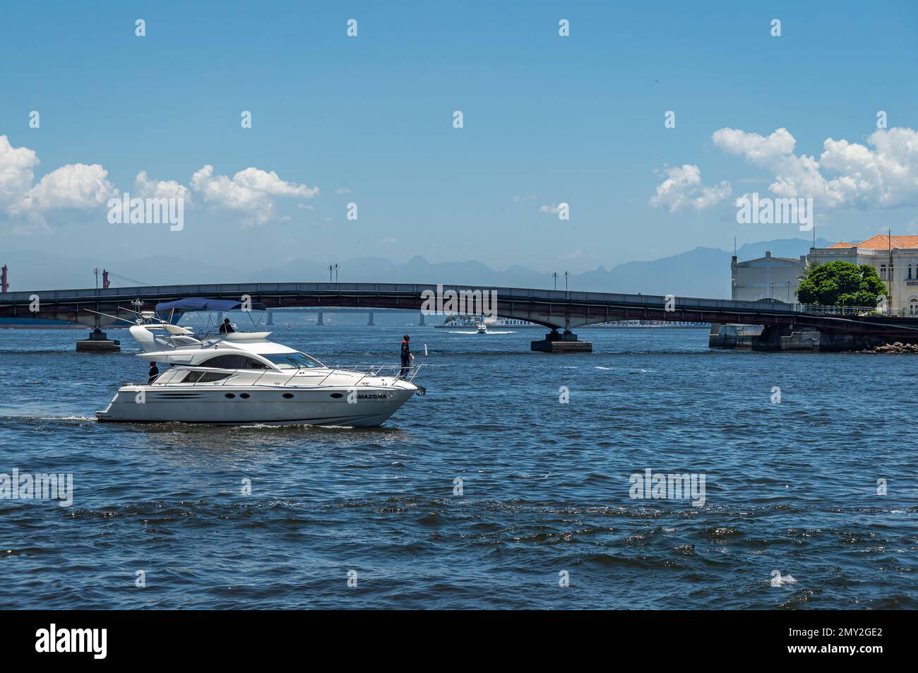 A white speedboat sailing on the waters of Guanabara bay, nearby Sao ...