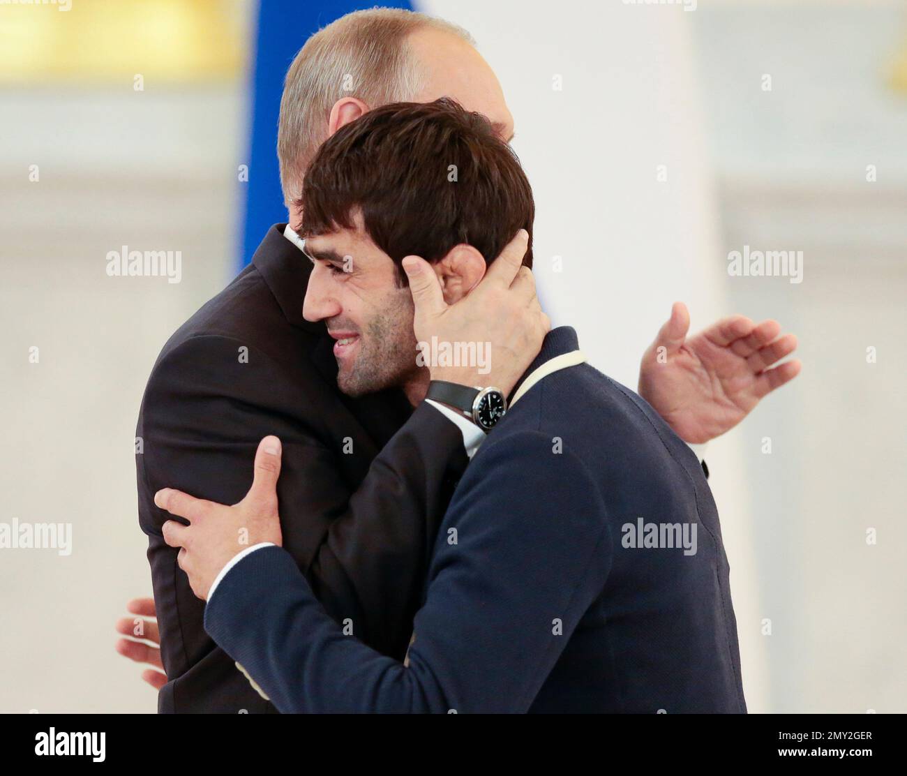 Russian President Vladimir Putin, left, embraces Russia's Beslan ...