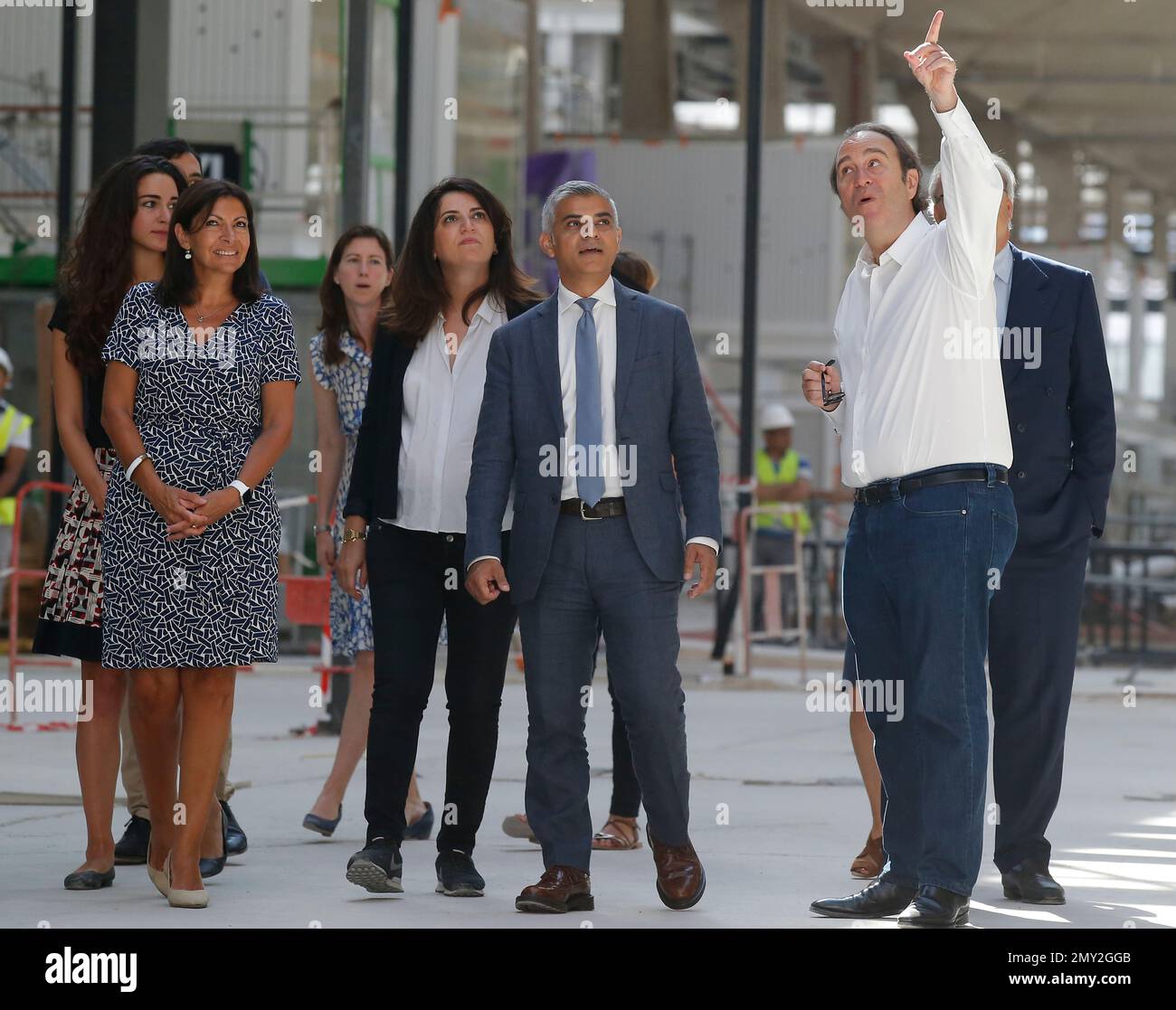 Paris mayor Anne Hidalgo, left, and London mayor Sadiq Khan listens to ...
