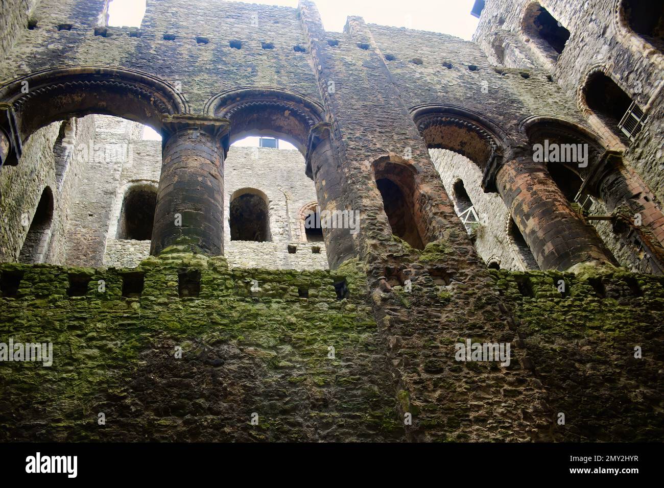 Inside the ruins of Rochester castle looking up at the stone structure ...