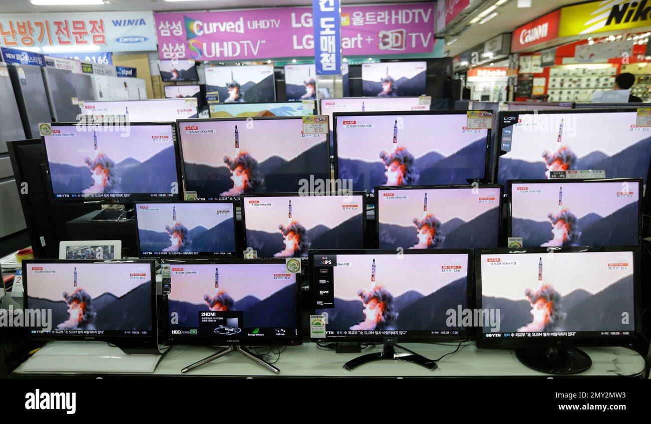 TV screens show file footage of a similar North Korea's ballistic ...