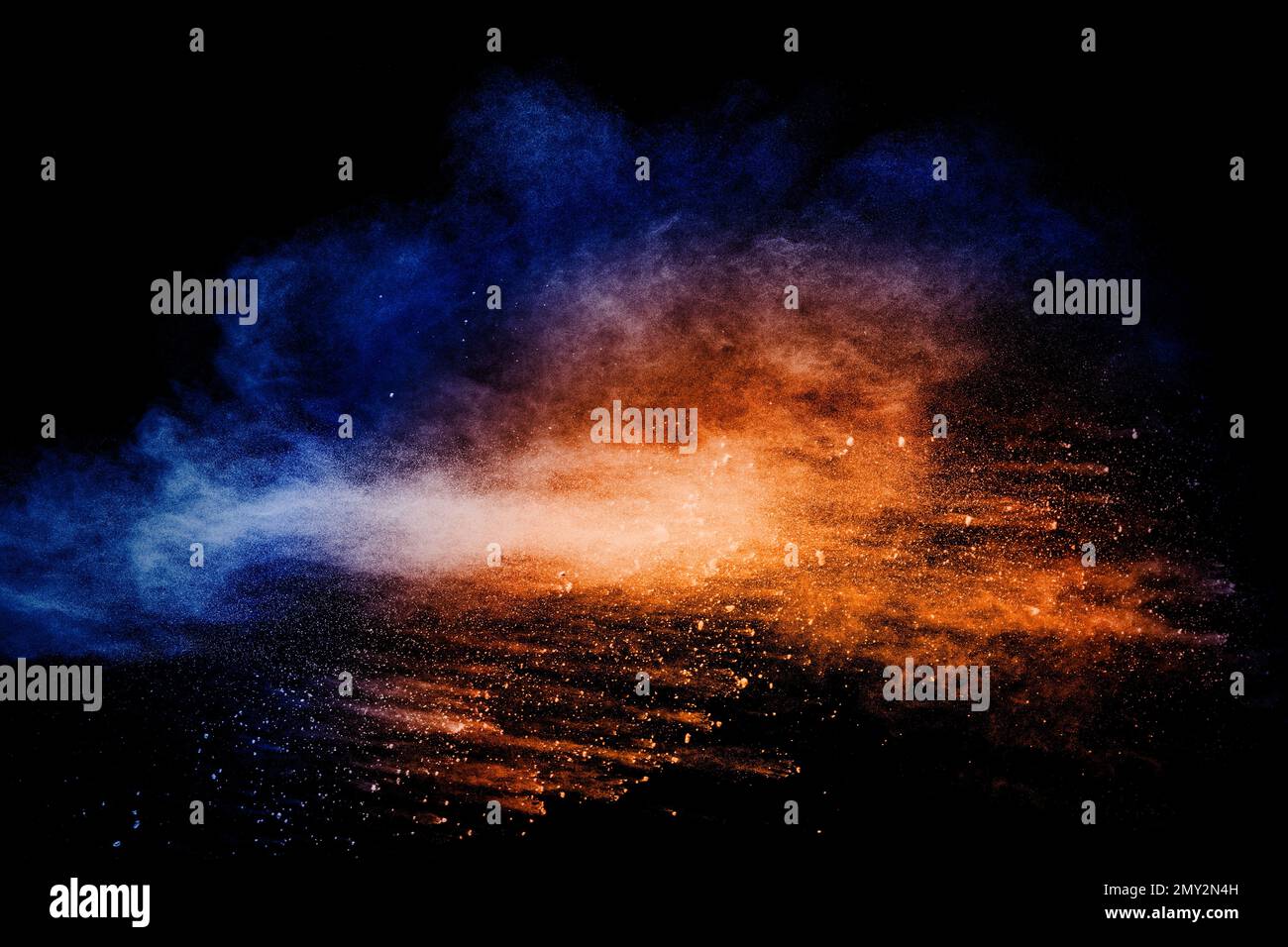 Orange blue powder explosion on black background.Orange blue color dust ...