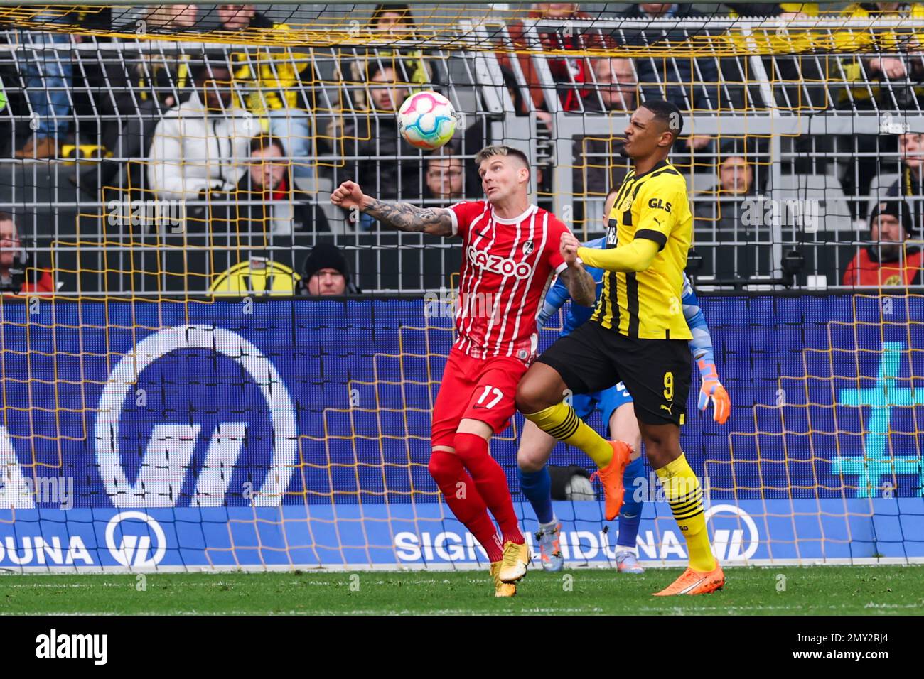DORTMUND, GERMANY - FEBRUARY 4: Lukas Kubler of SC Freiburg, Sebastien ...