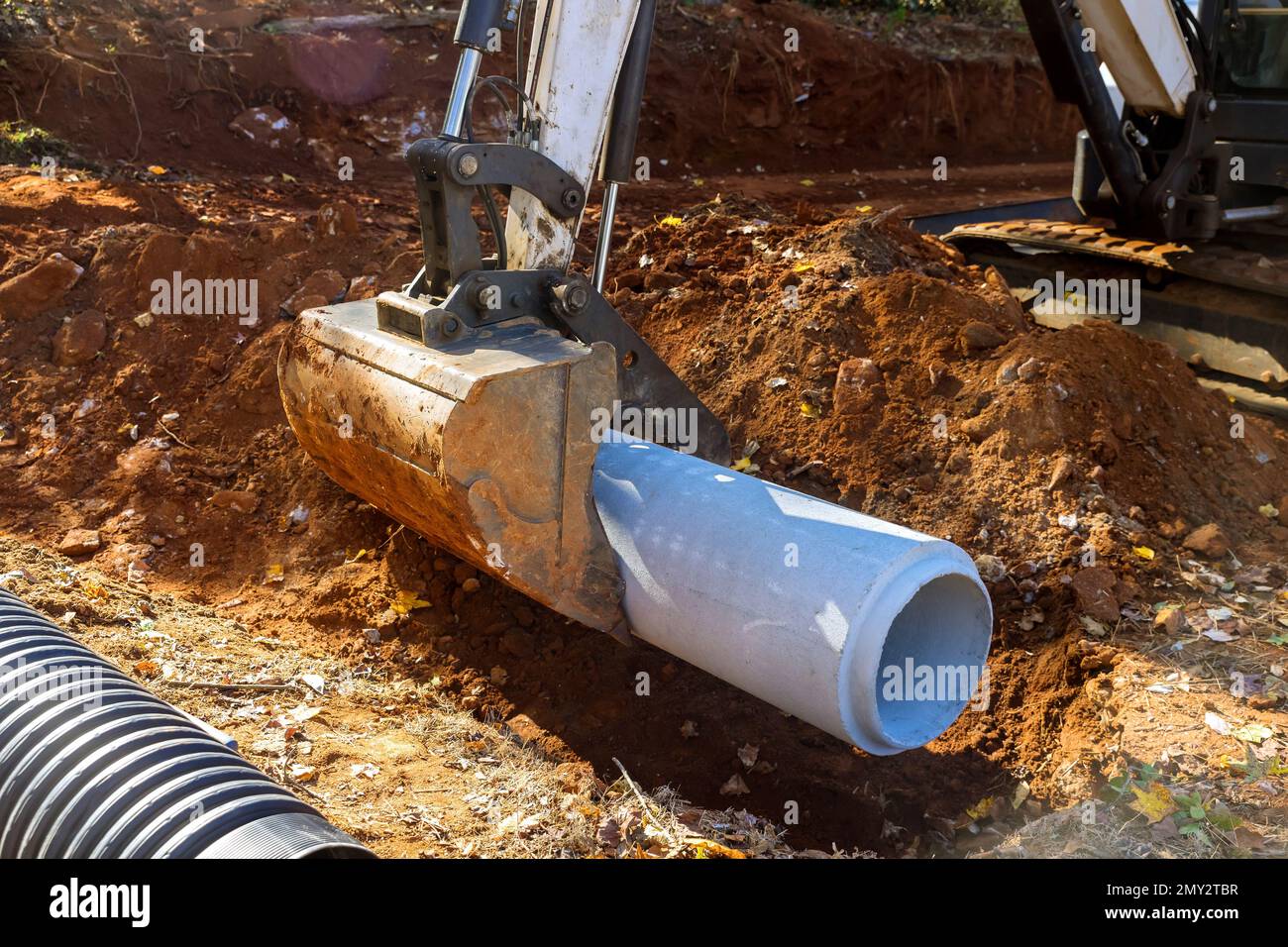 In preparation for underground installation of concrete sewage pipes ...