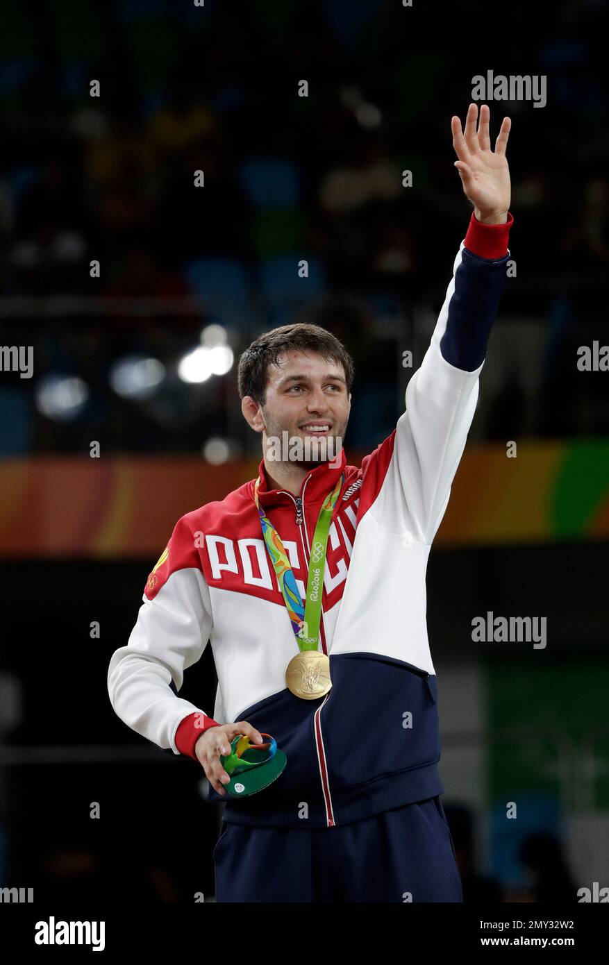 Russia's Soslan Ramonov celebrates with his gold medal during a medal ...