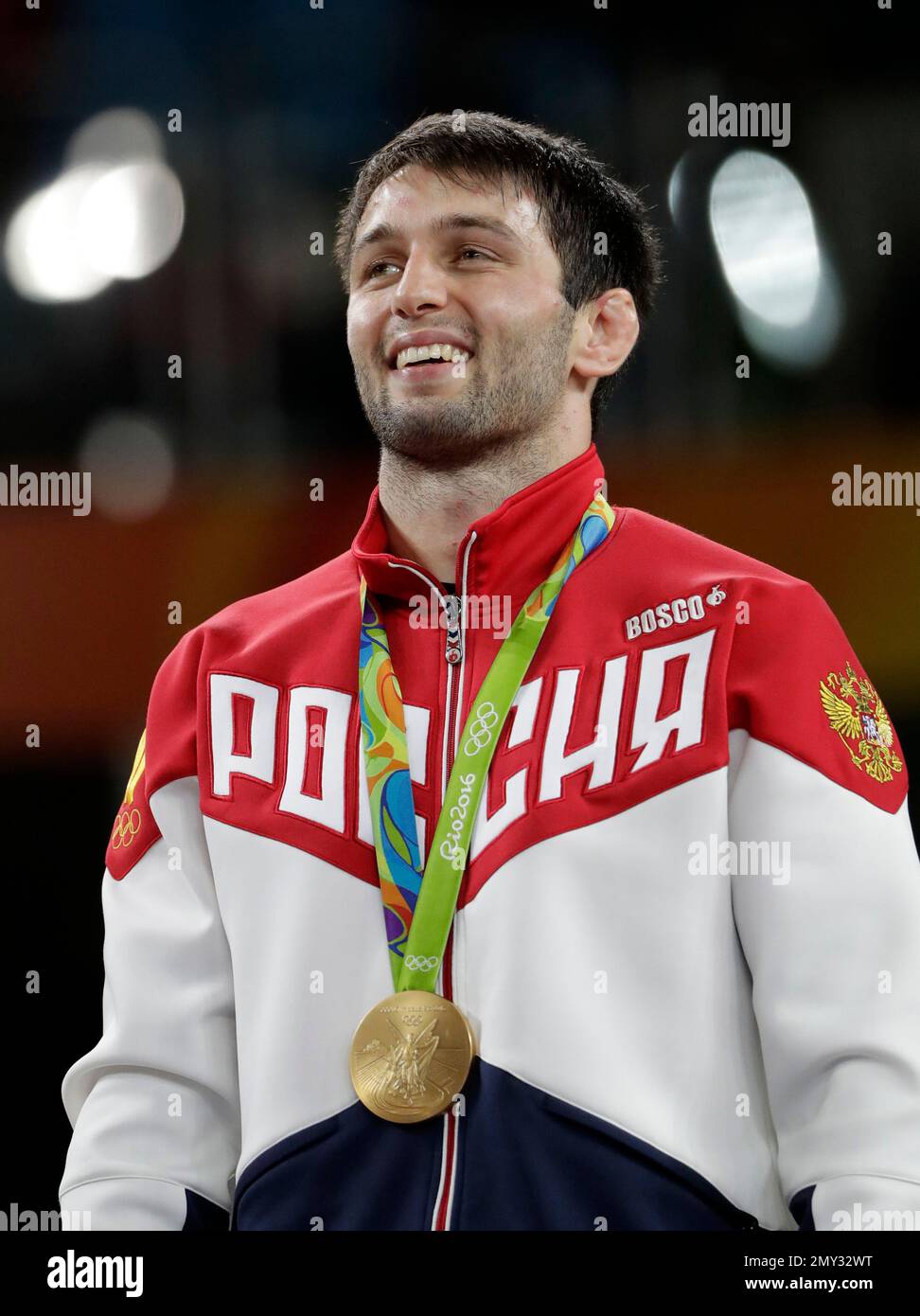Russia's Soslan Ramonov celebrates with his gold medal during a medal ...