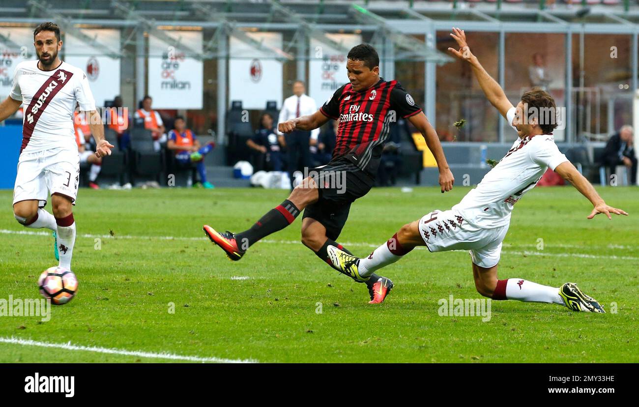 AC Milan's Carlos Bacca, center, scores during the Serie A soccer match ...