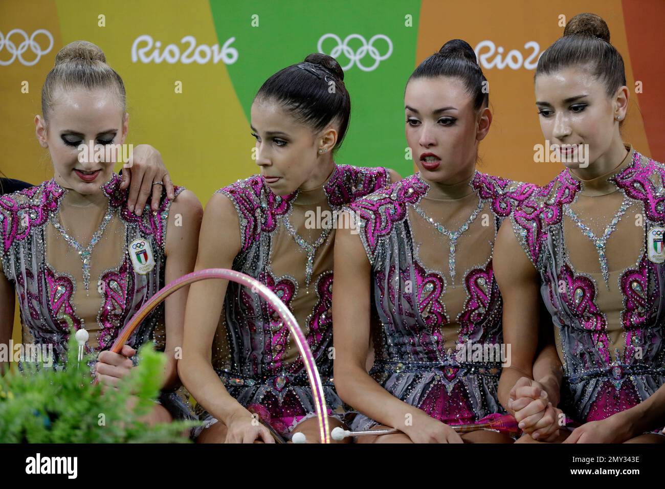 Team Italy waits for their score after performing during the rhythmic ...