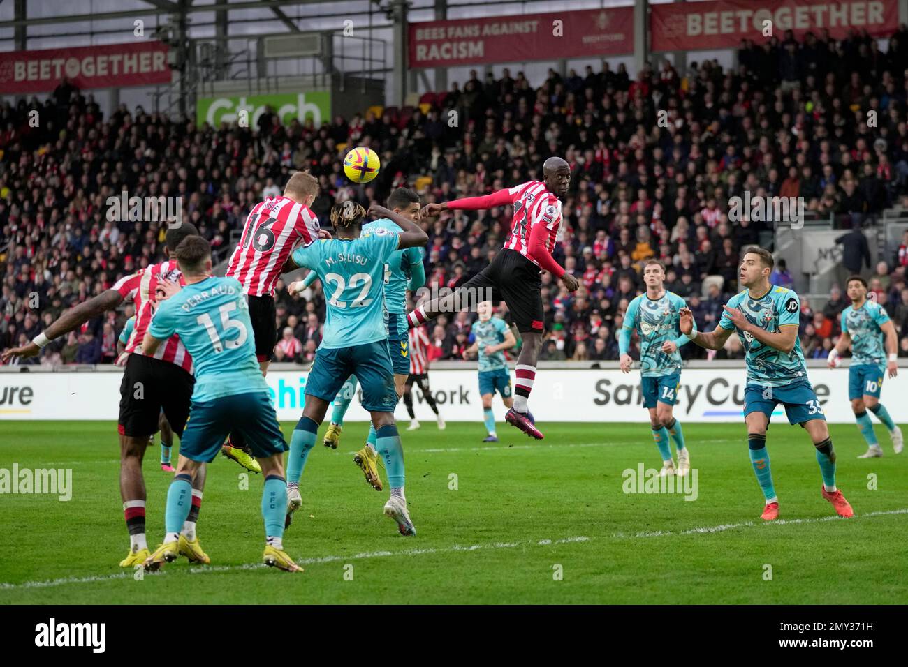 Brentford's Ben Mee, 3rd left, scores the opening goal during the ...