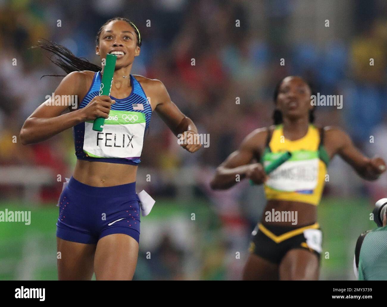 United States' Allyson Felix smiles as her tam wins the women's 4x400m ...
