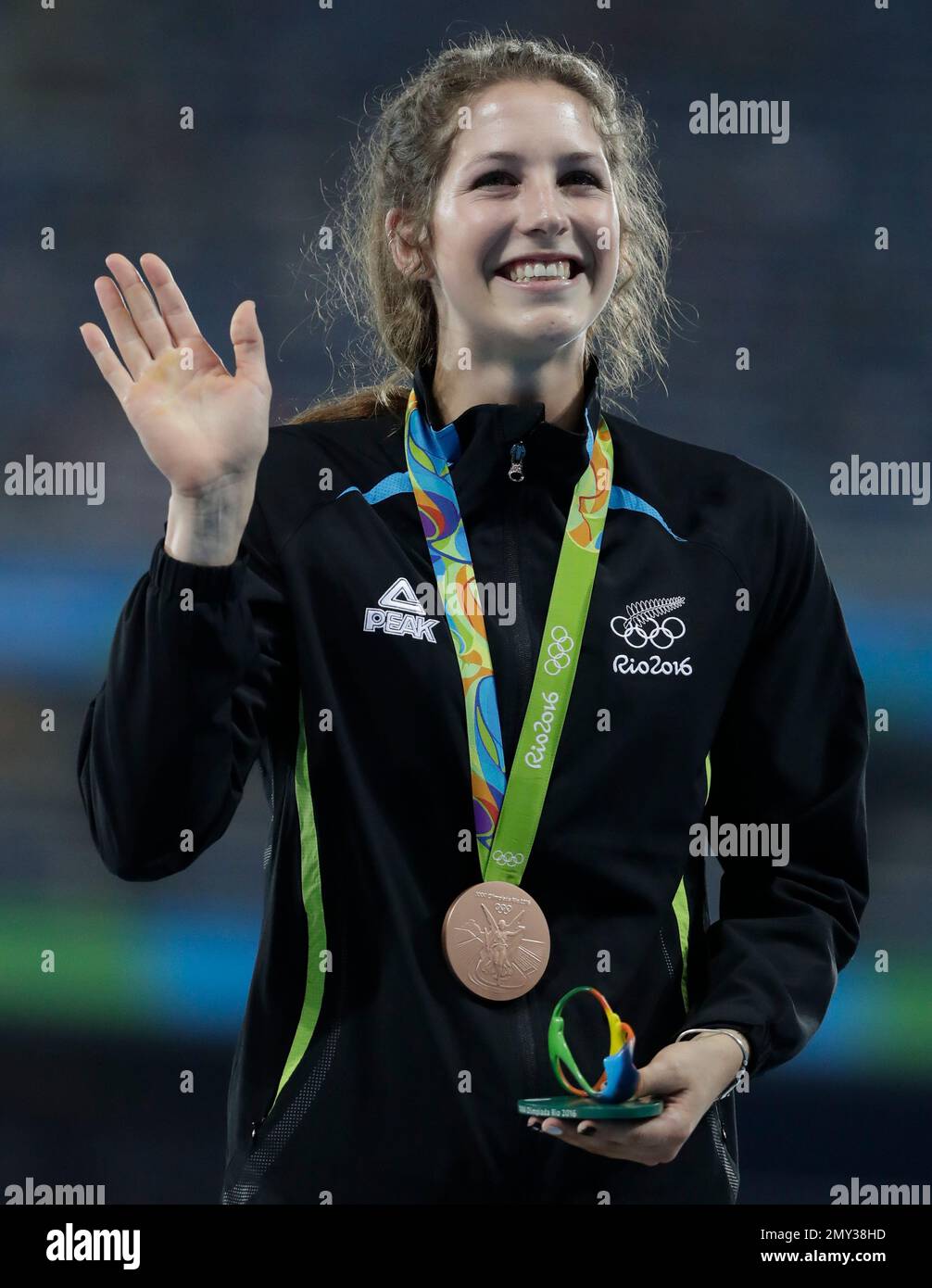 New Zealand's Eliza McCartney waves after receiving her bronze medal ...