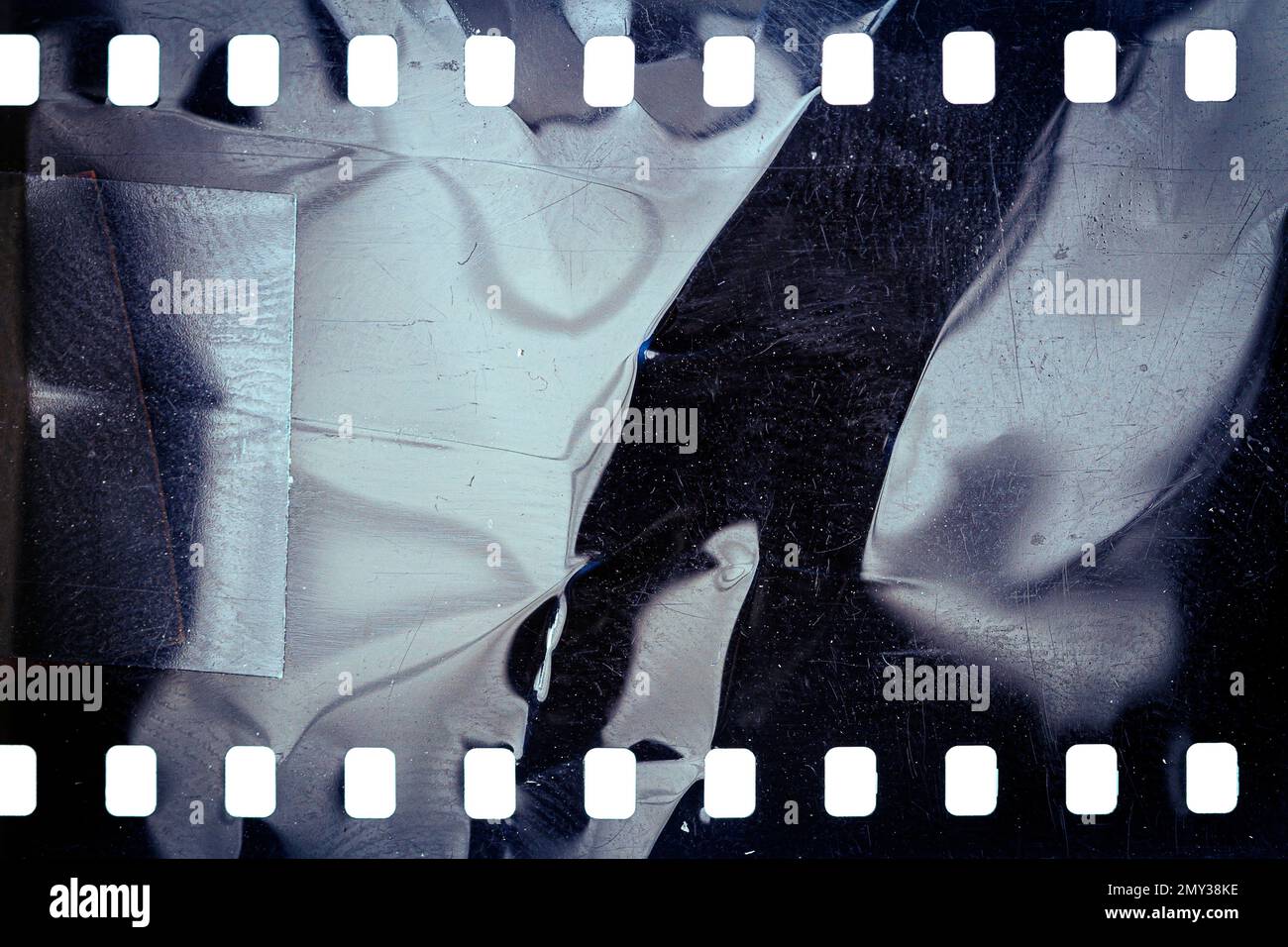 Dusty and grungy 35mm film texture or surface. Perforated scratched ...