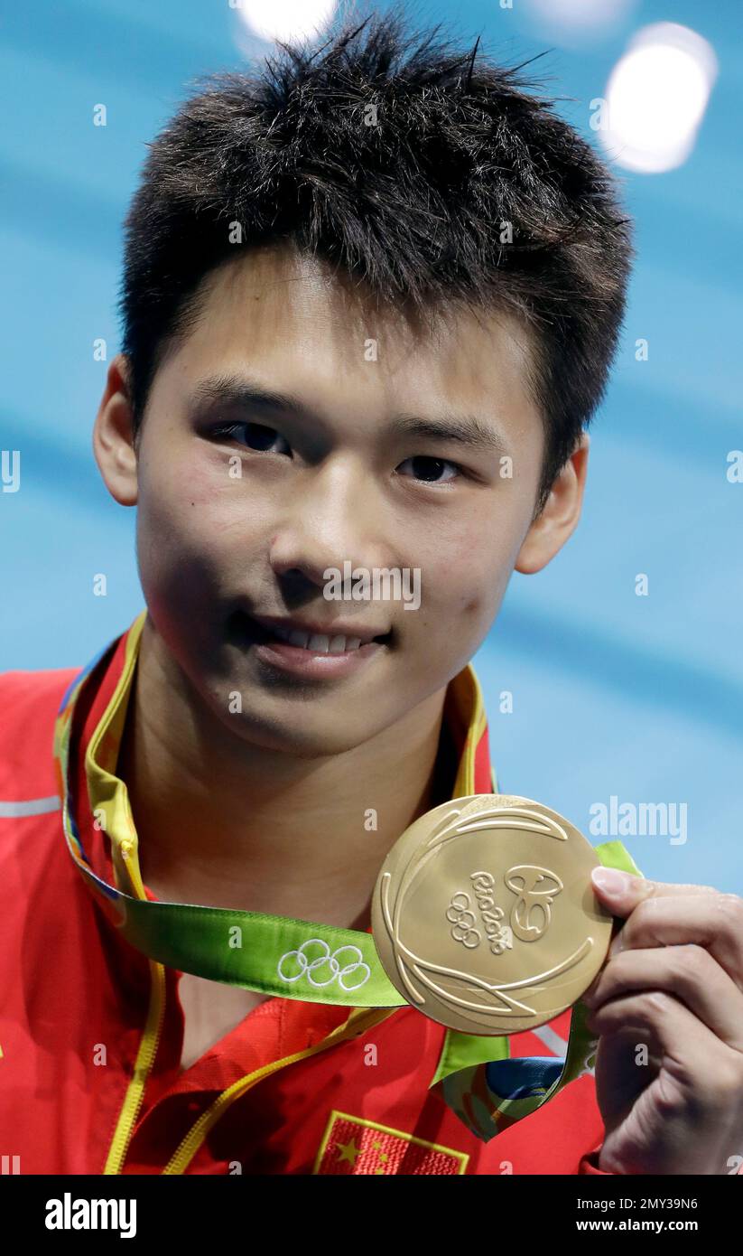 China's gold medalist Chen Aisen poses during the medal ceremony for ...