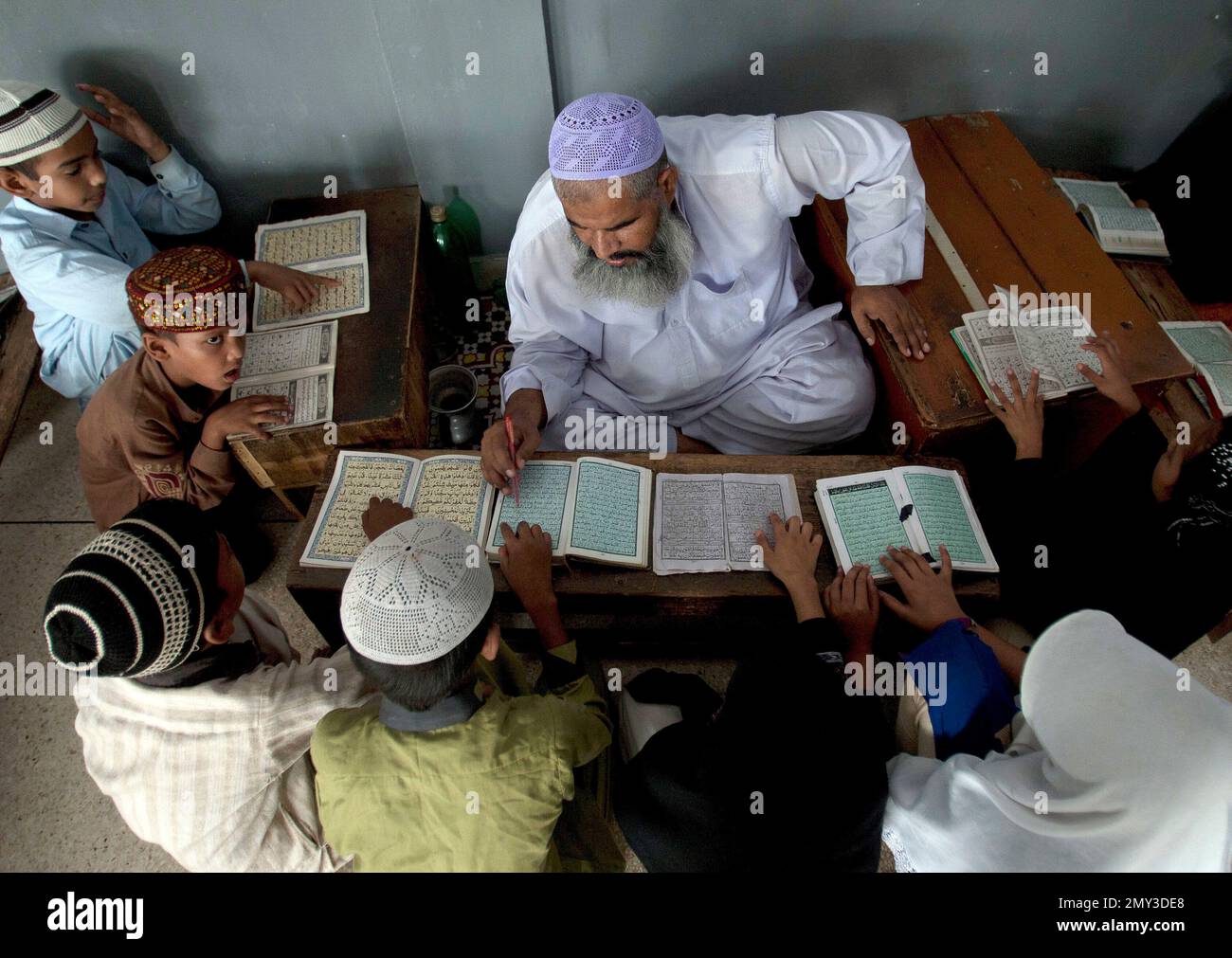 Pakistani Muslim children attend lessons to learn the Quran, Islam's ...