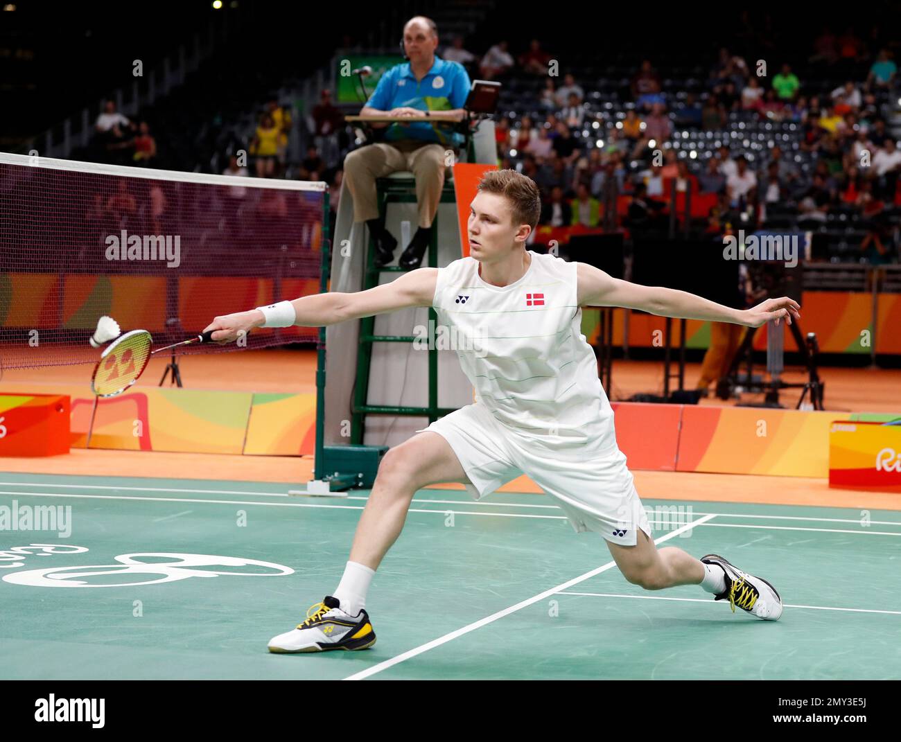 Denmark's Viktor Axelsen returns a shot to China's Lin Dan during the ...