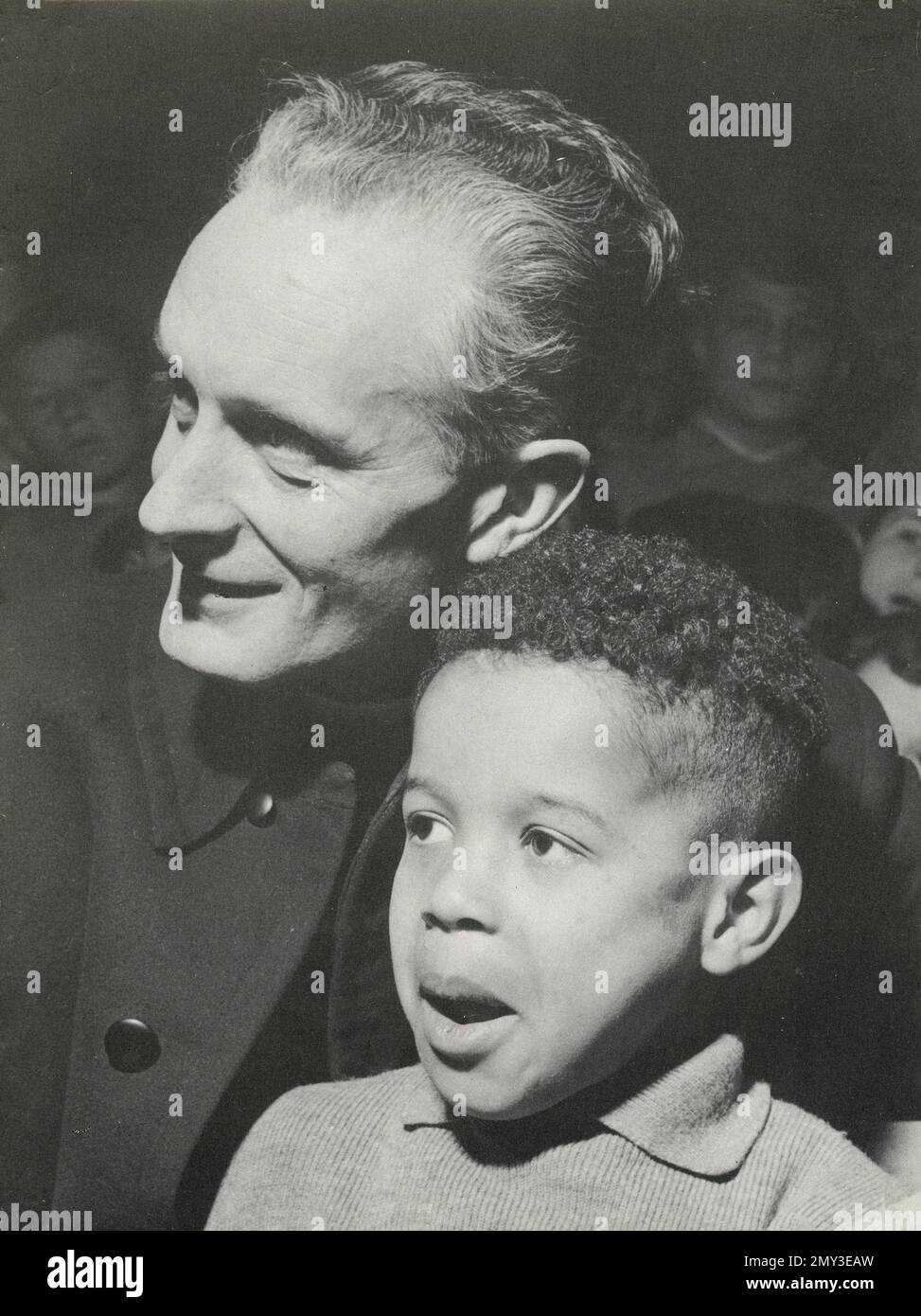 Italian priest Don Carlo Gnocchi with a child, Italy 1956 Stock Photo ...