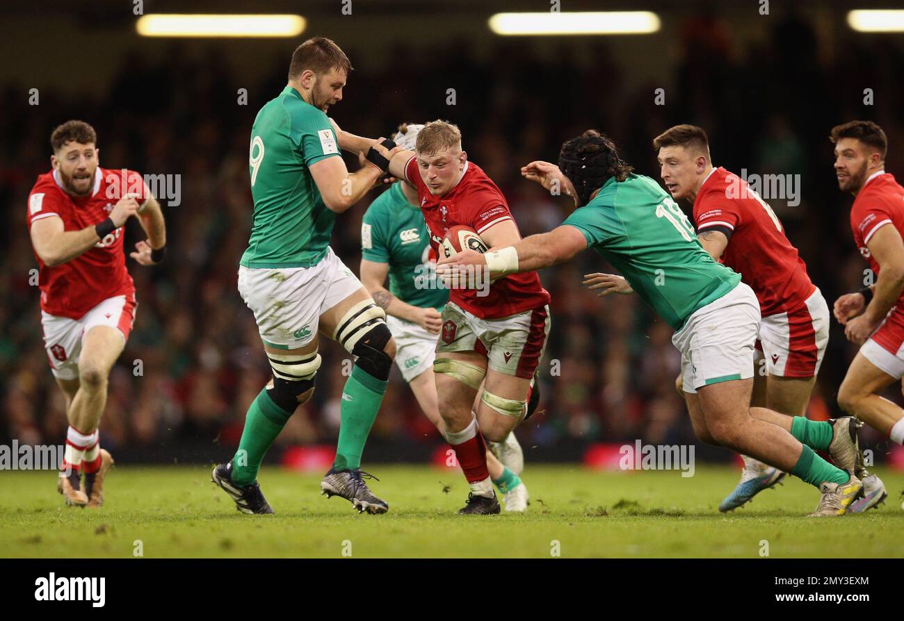 Wales' Jac Morgan is tackled by Ireland's Iain Henderson (left) and Tom ...