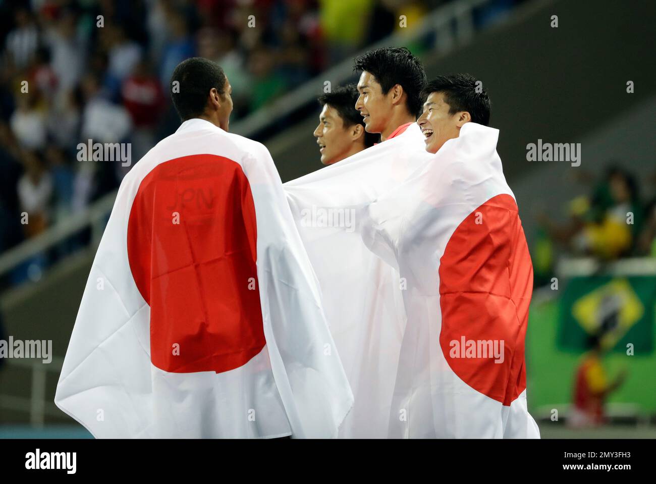 The Japan team celebrate winning the silver medal in the men's 4x100 ...