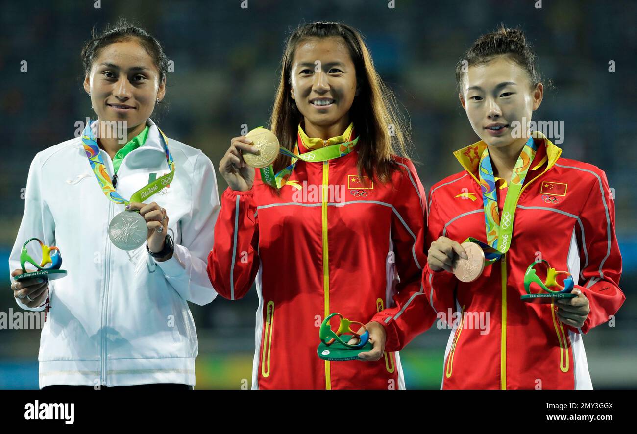 Gold medal winner China's Hong Liu, left, silver medal winner Mexico's ...