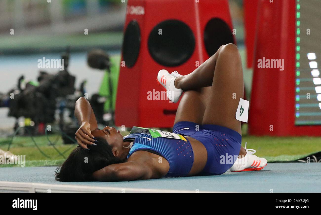United States' Francena McCorory lays on the track after running her ...